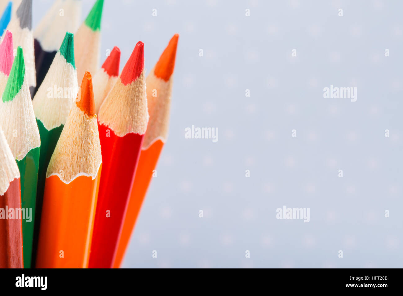 Colored pencils on a light background with point. Bunch of the pencils ...
