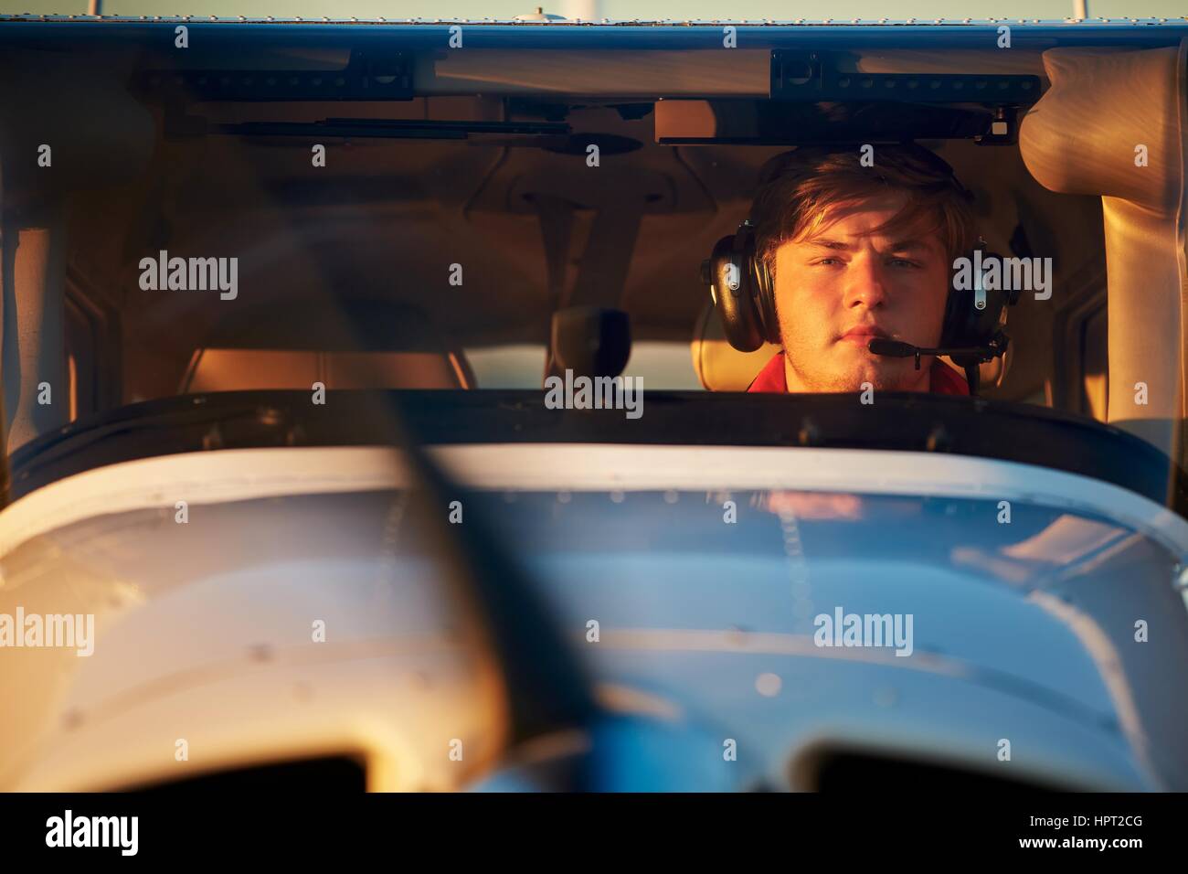 Young pilot is preparing for take off with private plane Stock Photo ...