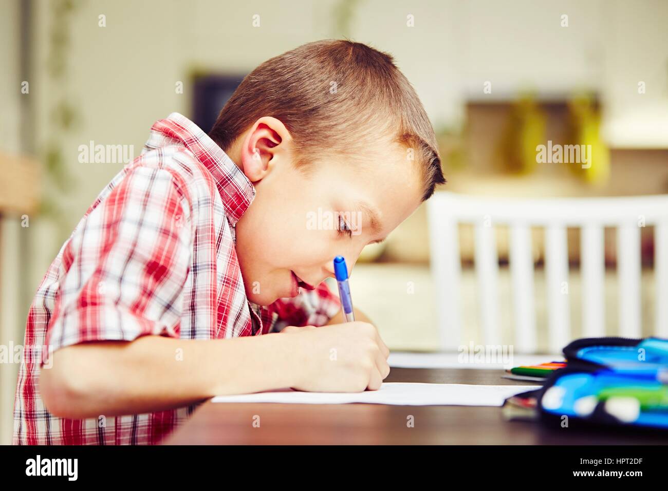 Little boy is doing his homework for elementary school Stock Photo - Alamy