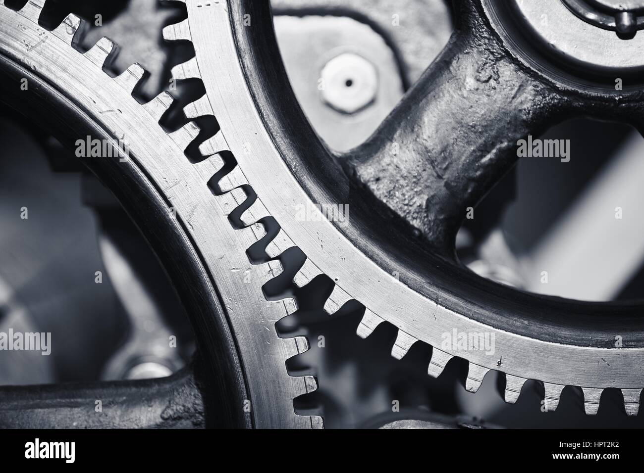 Large cog wheels in the motor - selective focus Stock Photo - Alamy