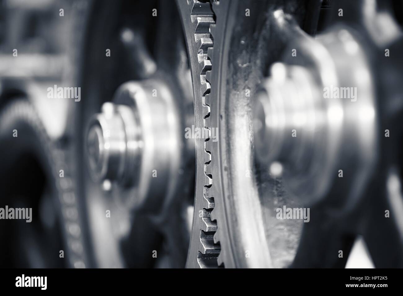 Large cog wheels in the motor - selective focus Stock Photo - Alamy