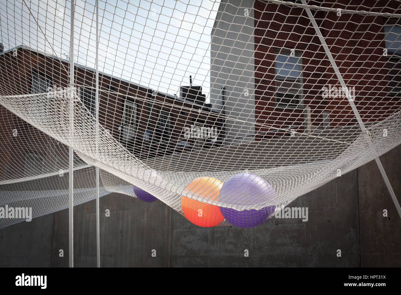 Art installation with exercise balls and nets in PS1, Queens, New York ...