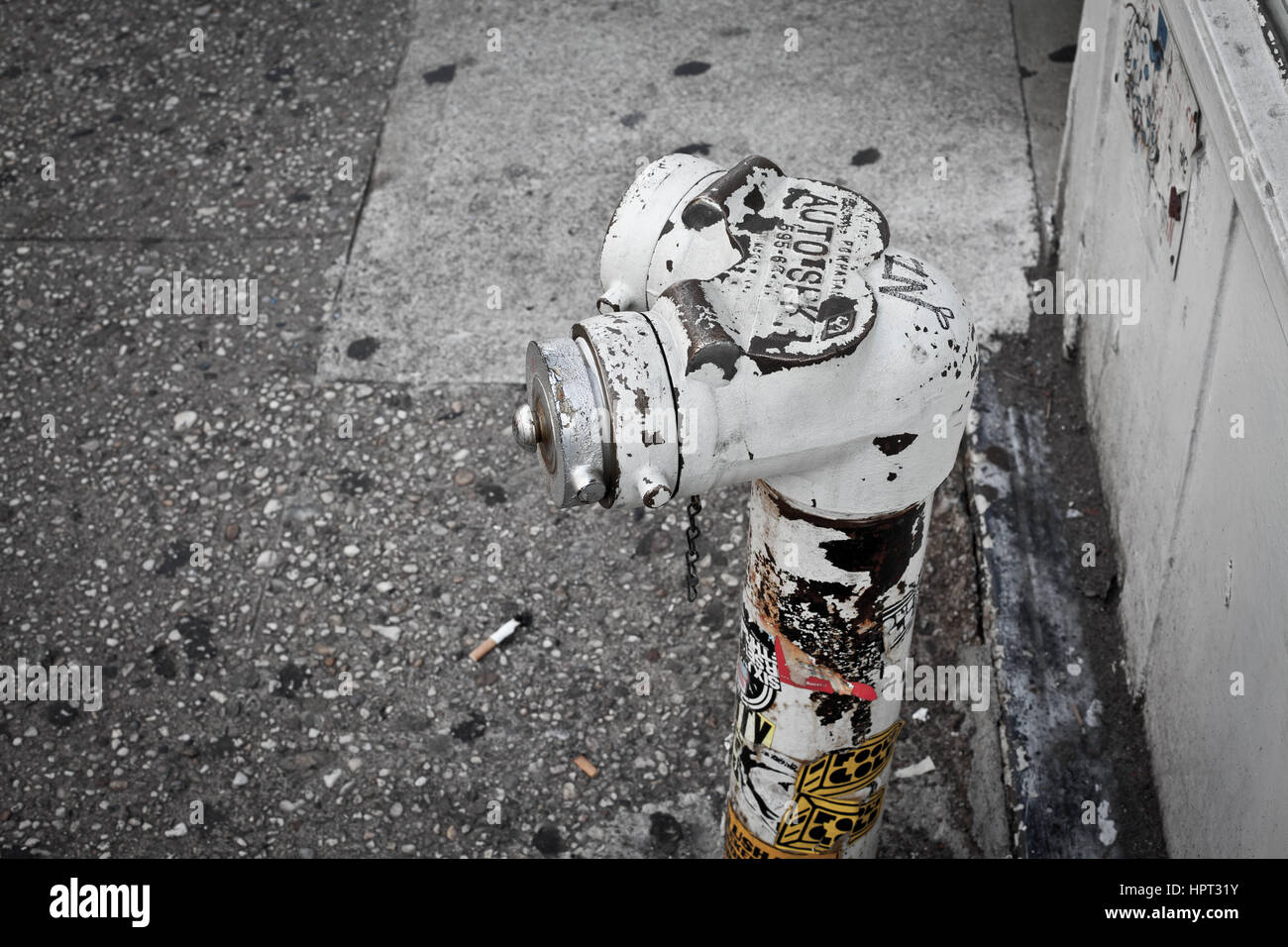 Fire hydrant covered with stickers Stock Photo - Alamy