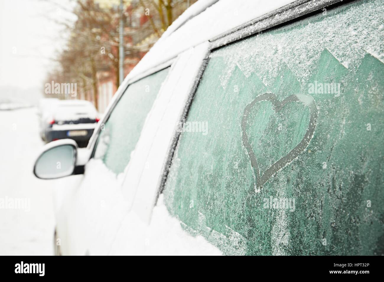 Heart symbol on frozen window of the car Stock Photo - Alamy