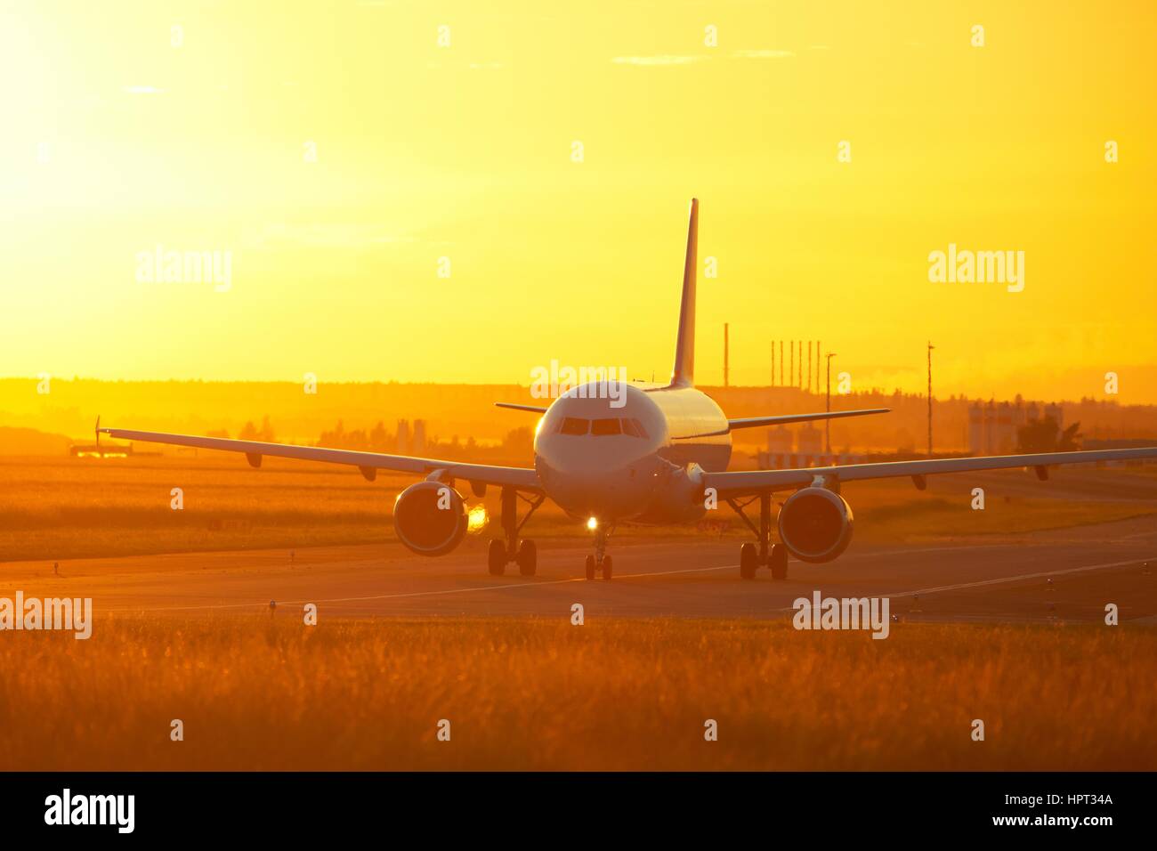 Airport at the sunset - back lit Stock Photo - Alamy