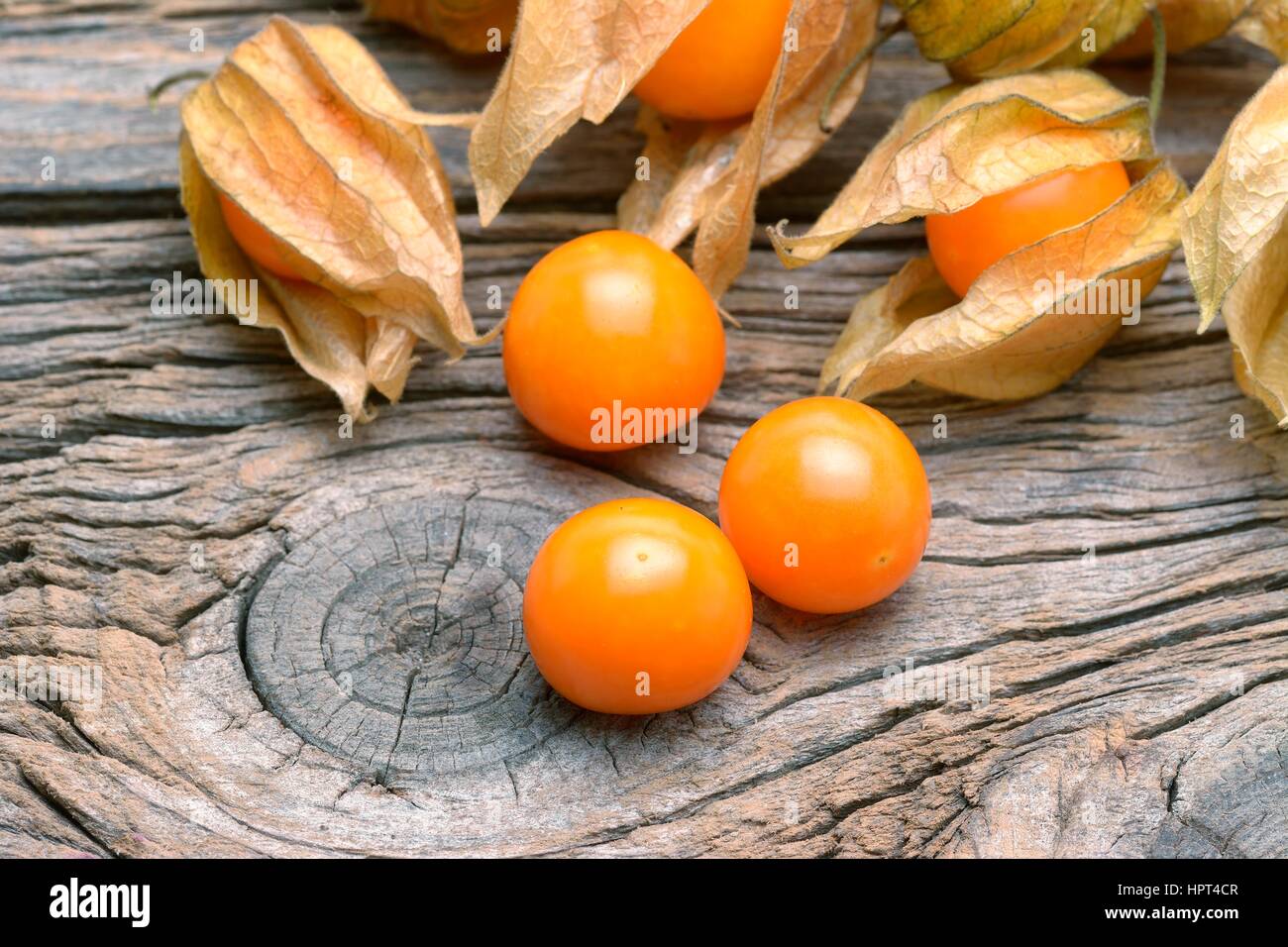 physalis on wooden old table Stock Photo - Alamy