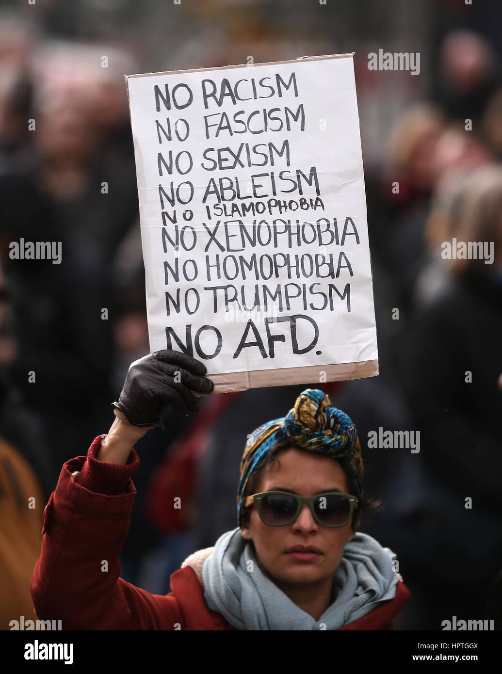 A demonstrator protests with a poster against the AfD (Alternative for ...