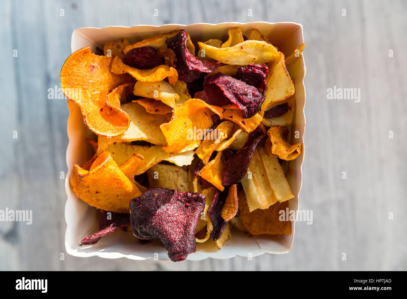 Vegetable chips with pyramide salt Stock Photo - Alamy