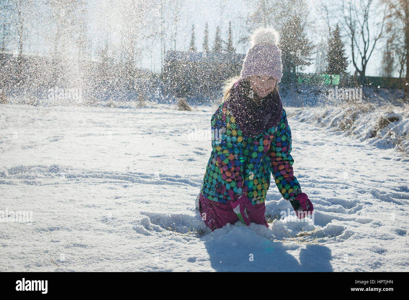 Girl throwing snow in air hi-res stock photography and images - Alamy