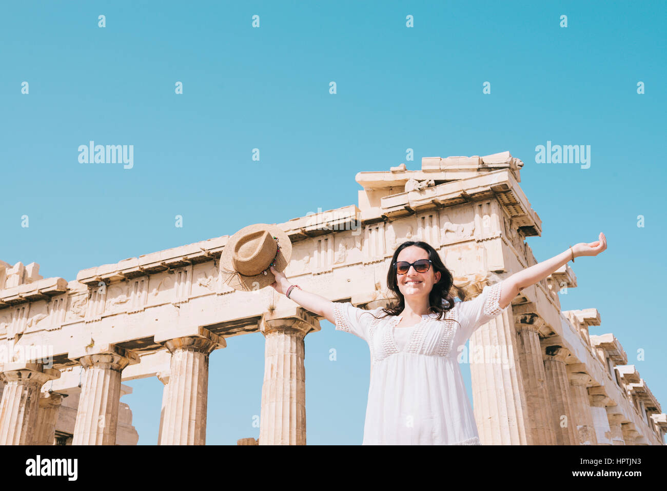 Greece, Athens, happy woman visiting the Parthenon temple on the ...