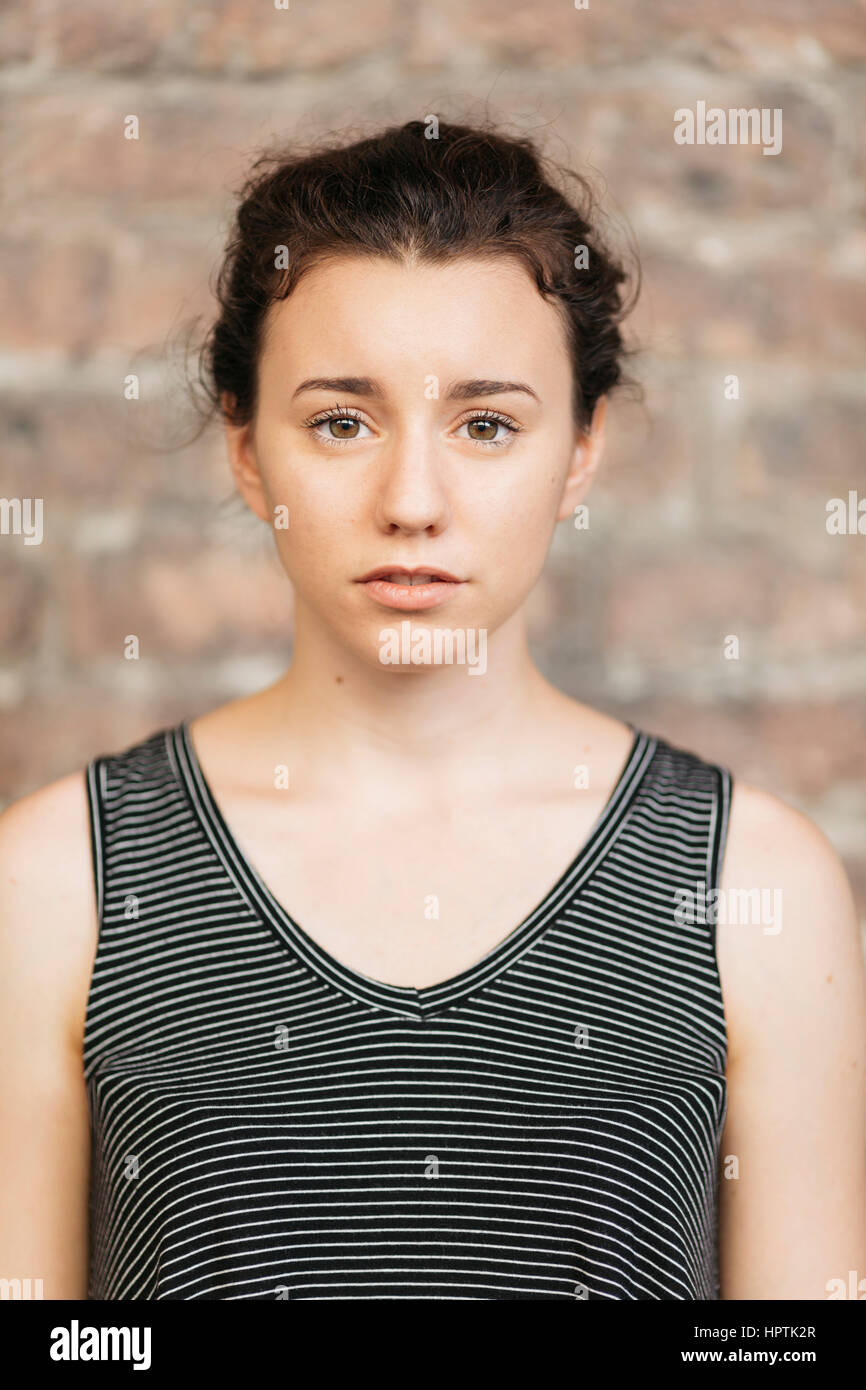 Portrait of serious young woman Stock Photo - Alamy