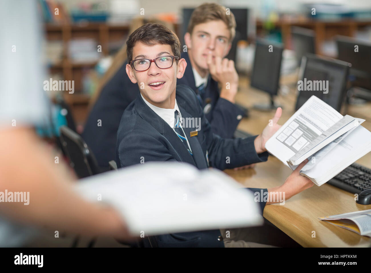 High school student with book discussing Stock Photo - Alamy