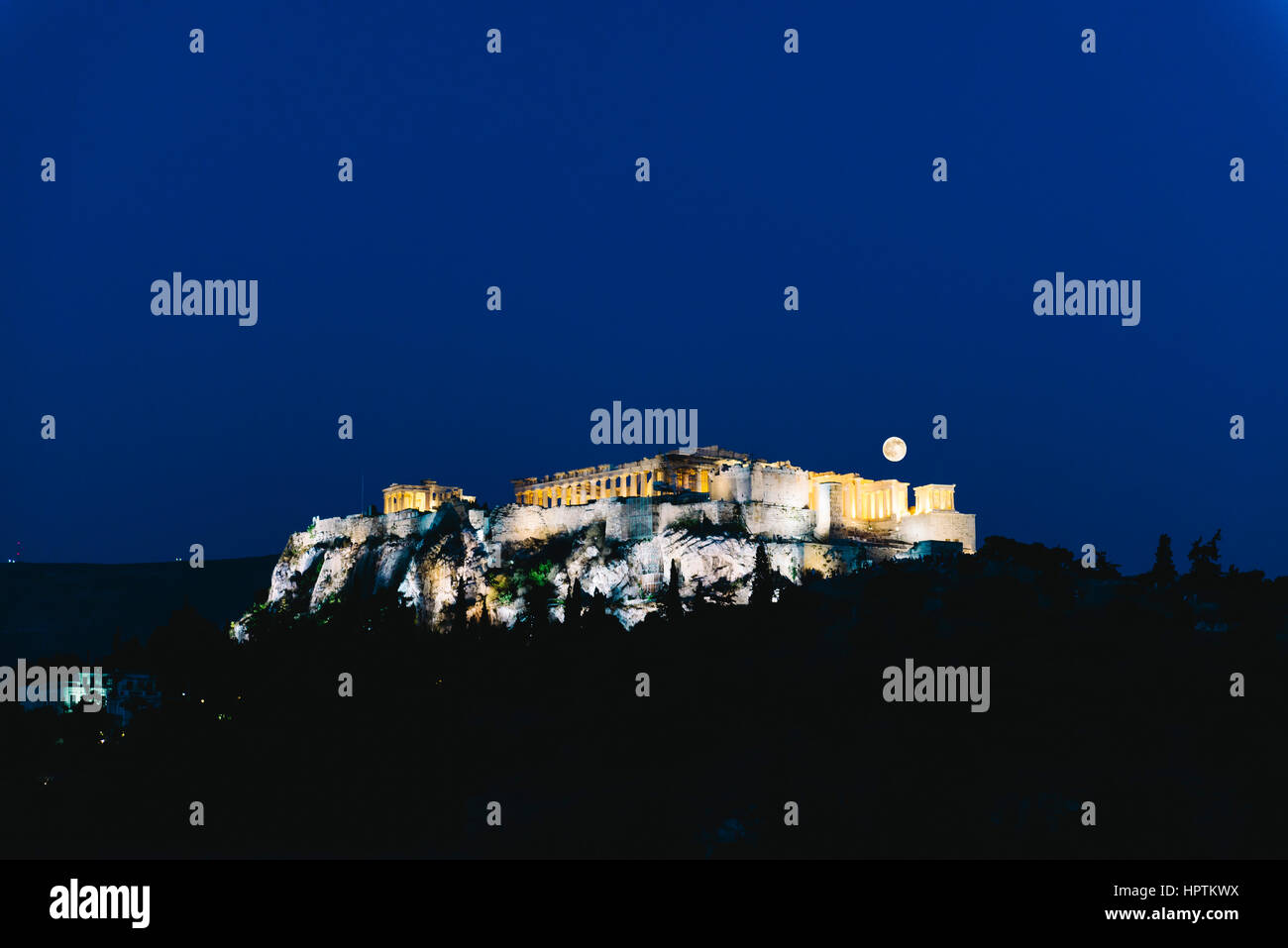 Greece, Athens, illuminated Acropolis in a moonlit night Stock Photo ...
