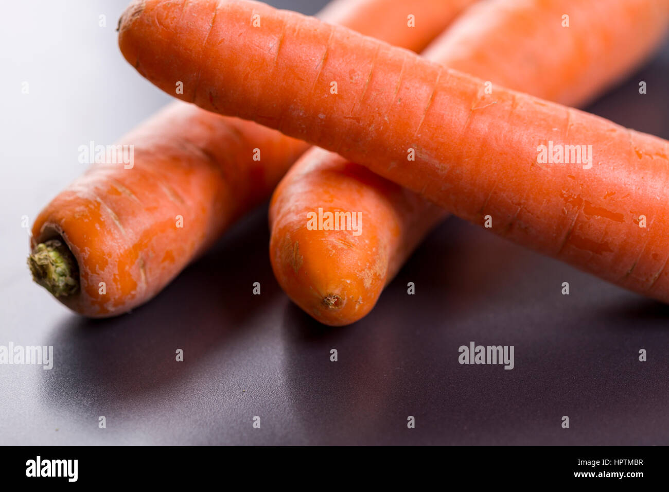 Three carrots, close-up Stock Photo - Alamy