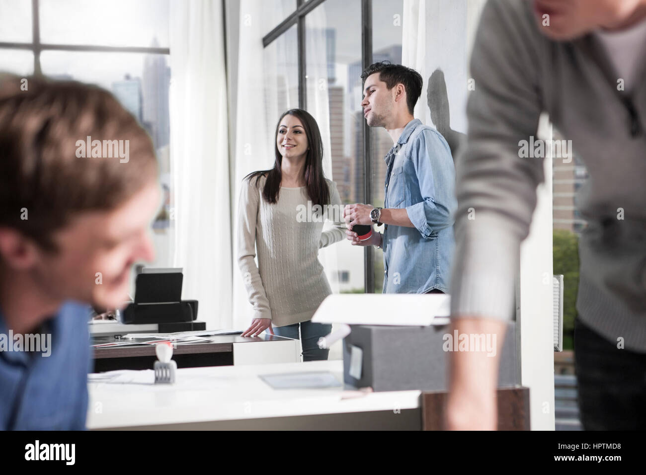 Colleagues talking in modern office Stock Photo - Alamy