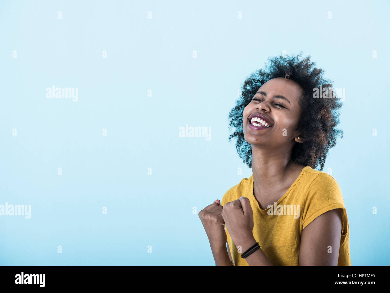 Portrait of excited young woman Stock Photo - Alamy
