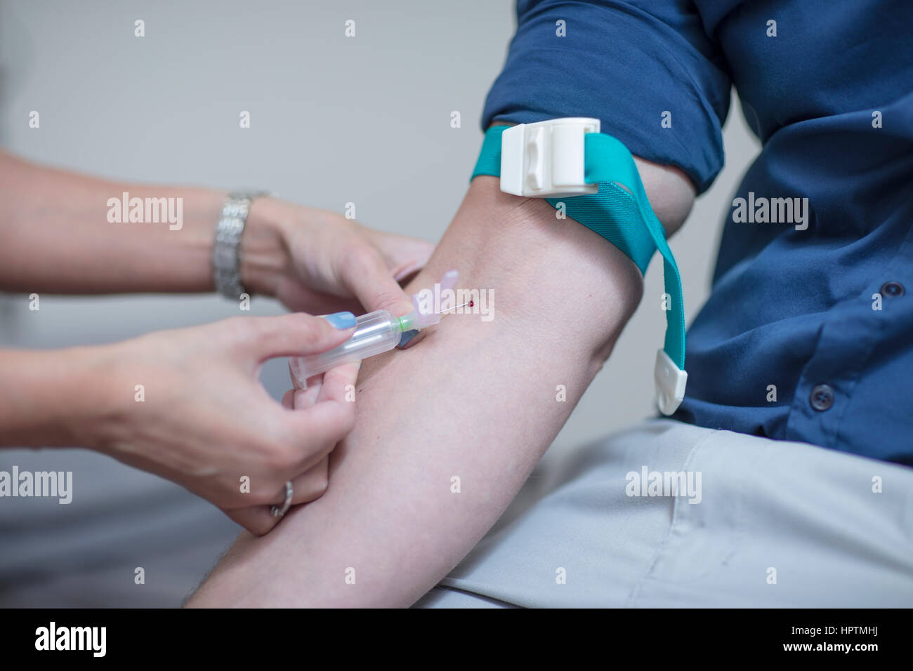 Nurse taking blood sample Stock Photo - Alamy