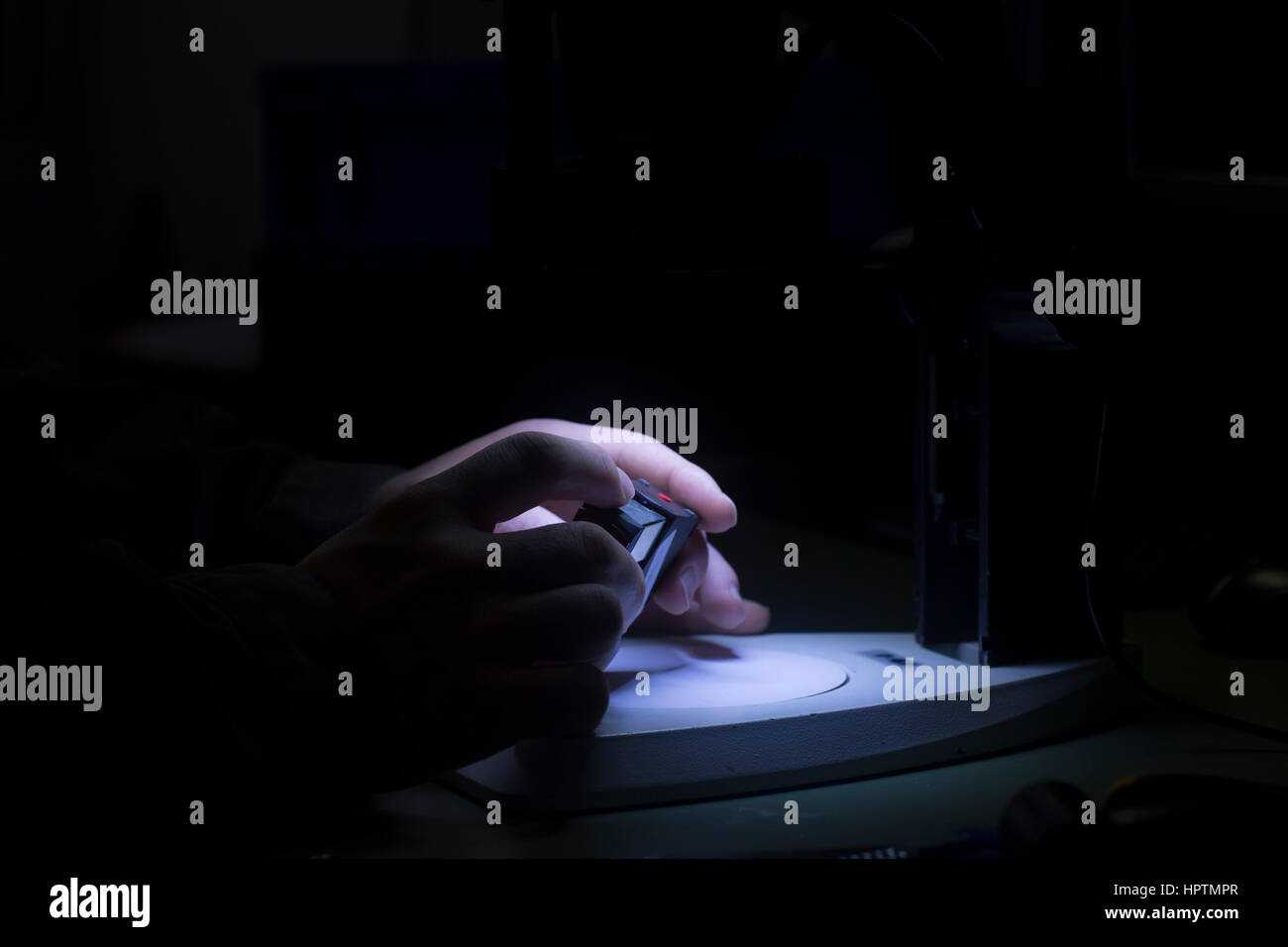 Hand holding sensoric device Stock Photo - Alamy
