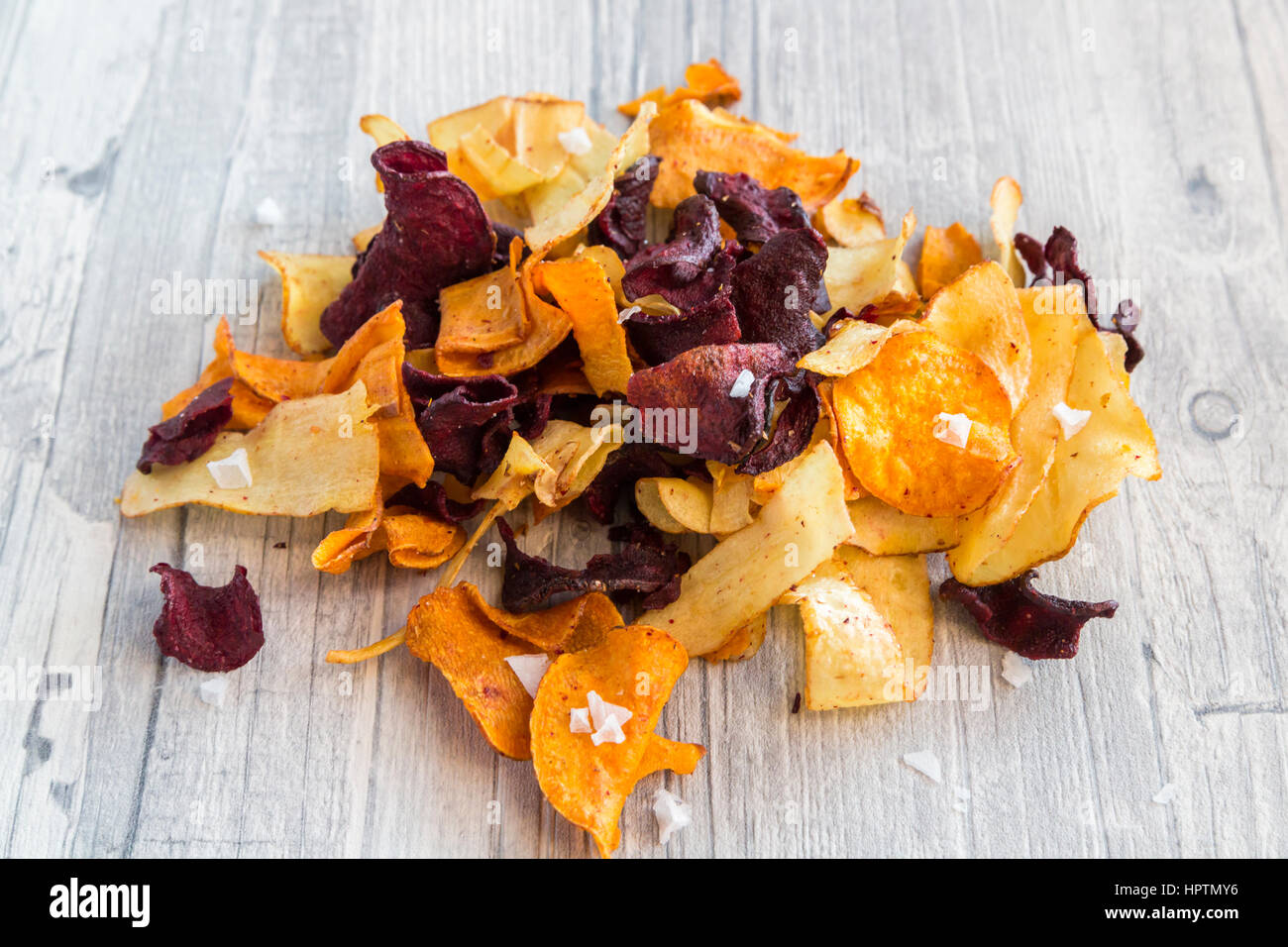 Vegetable chips with pyramide salt Stock Photo - Alamy