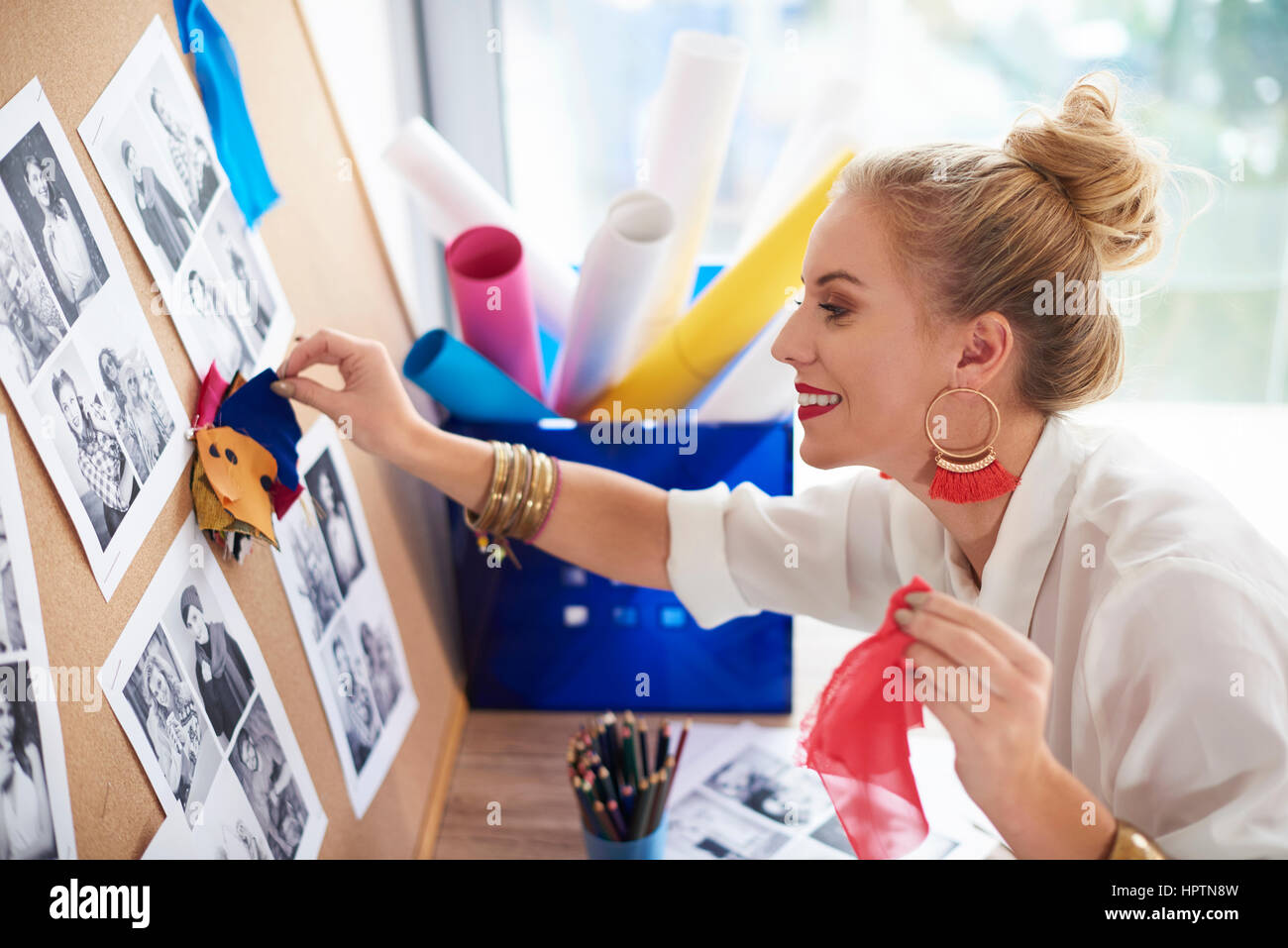 Designing her new clothes line Stock Photo - Alamy