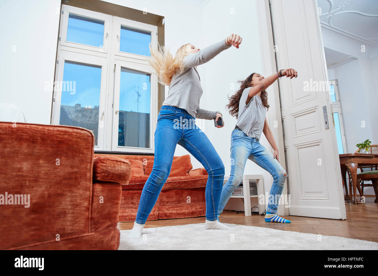 Two girls dancing at home Stock Photo - Alamy