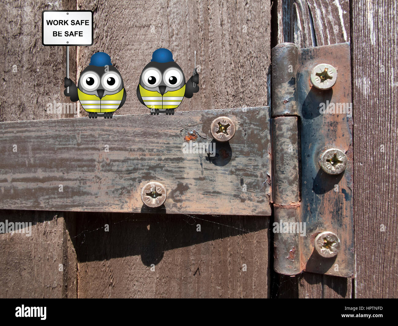 Comical bird construction workers perched on an old rusty hinge with ...