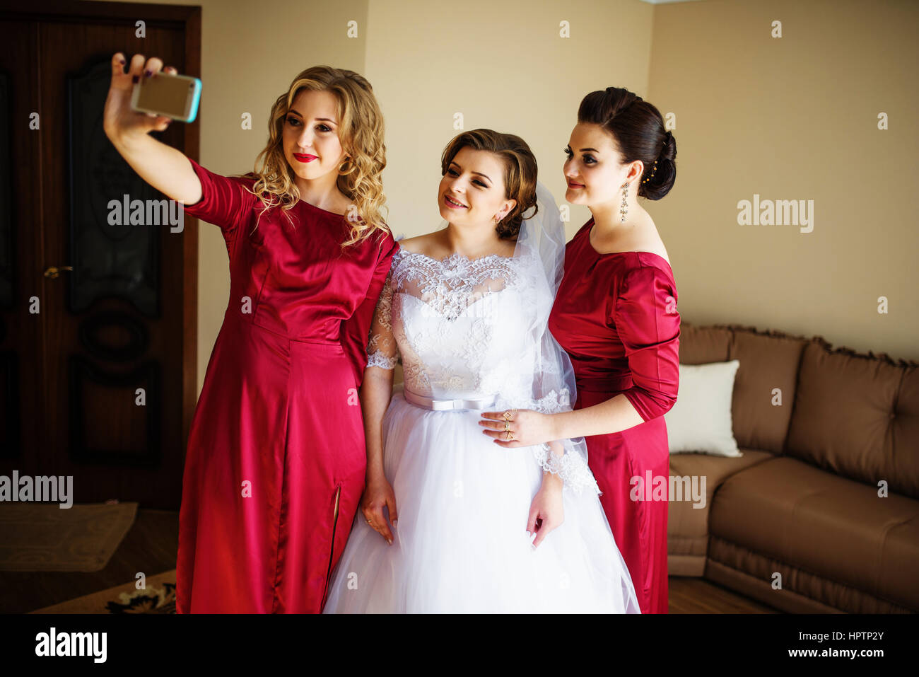 Bride with bridesmaids making selfie at wedding day Stock Photo - Alamy
