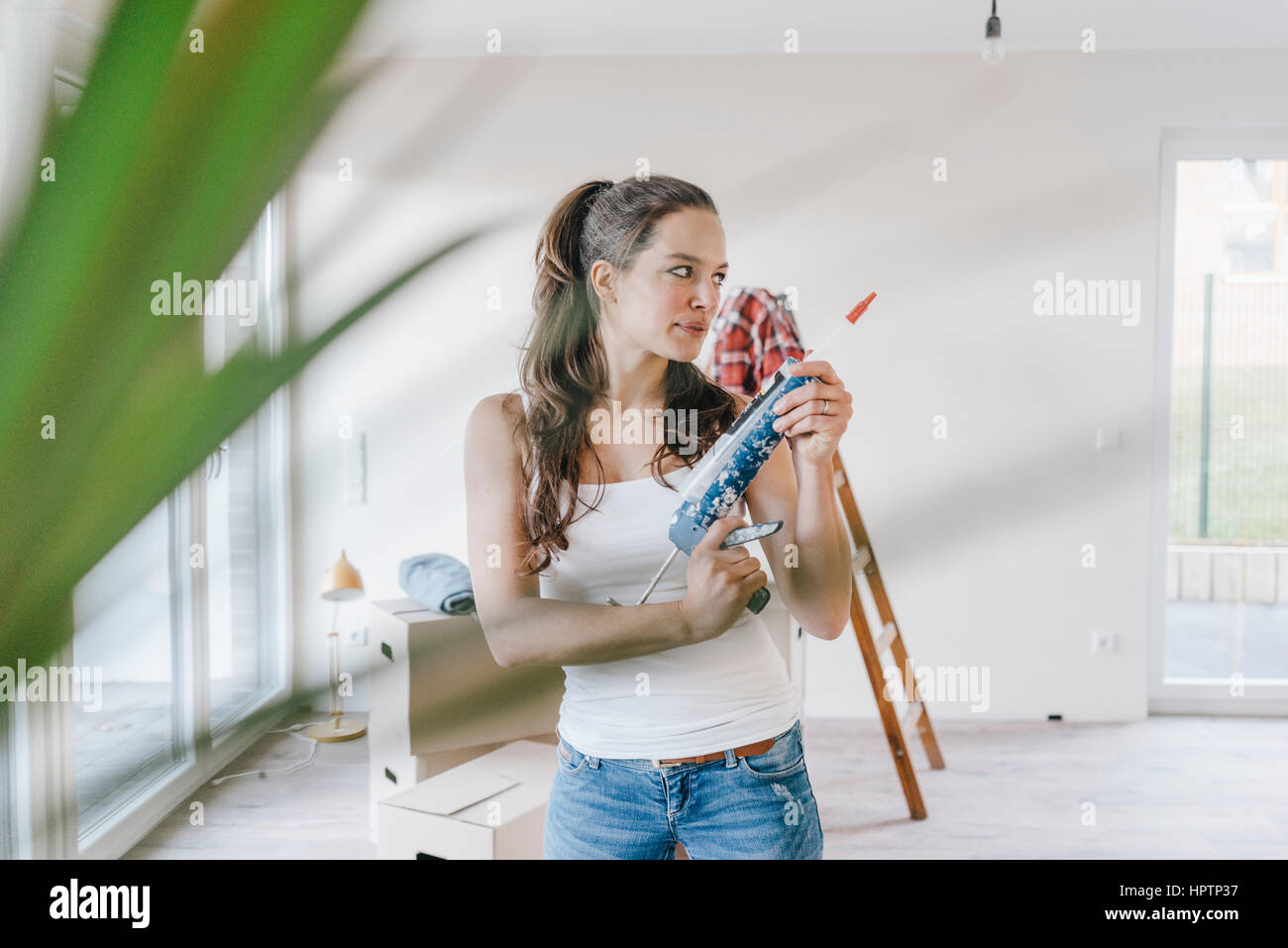 Woman holding gun hi-res stock photography and images - Alamy
