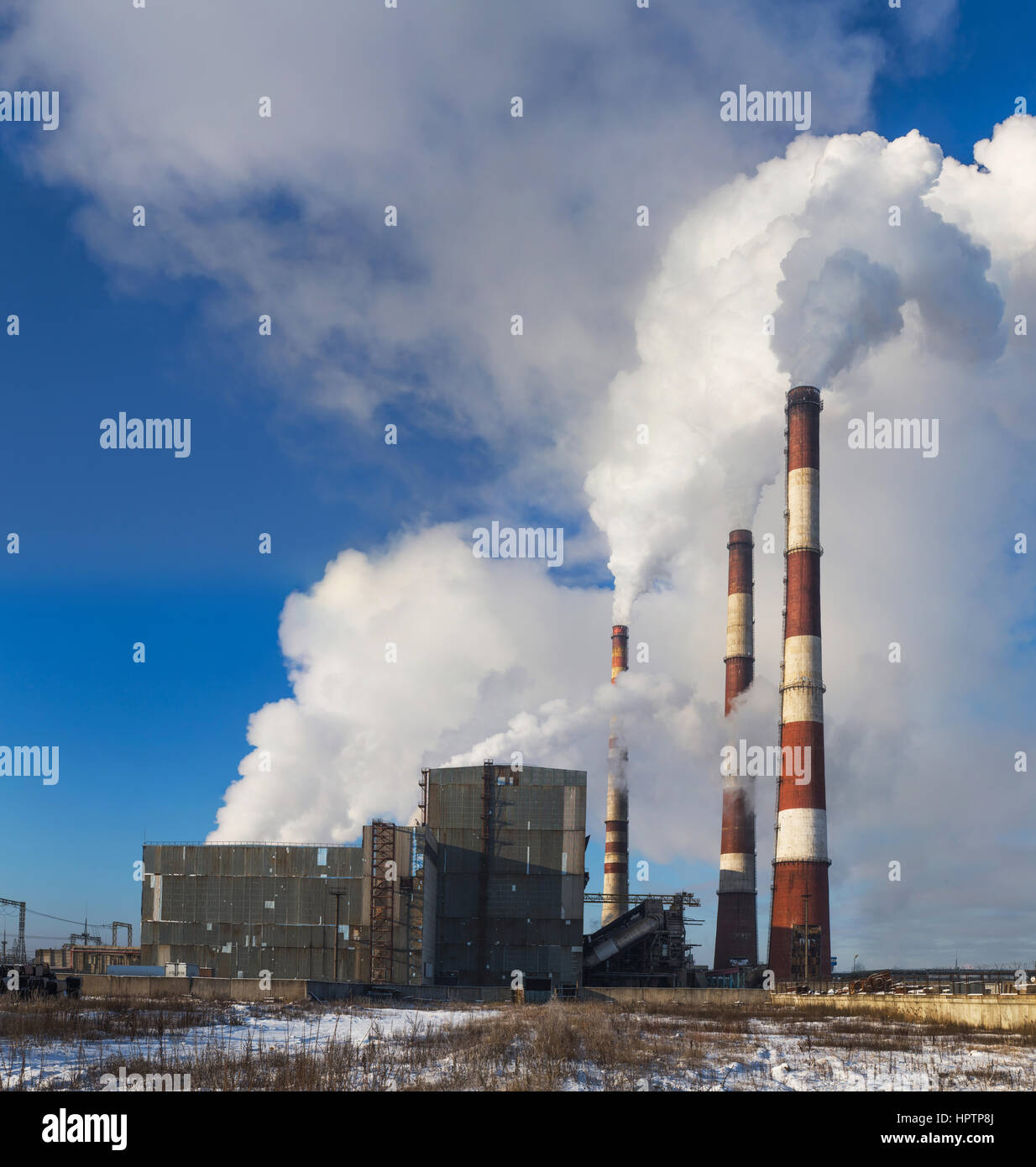 Power plant smoking in the sky with thick white smoke Stock Photo - Alamy