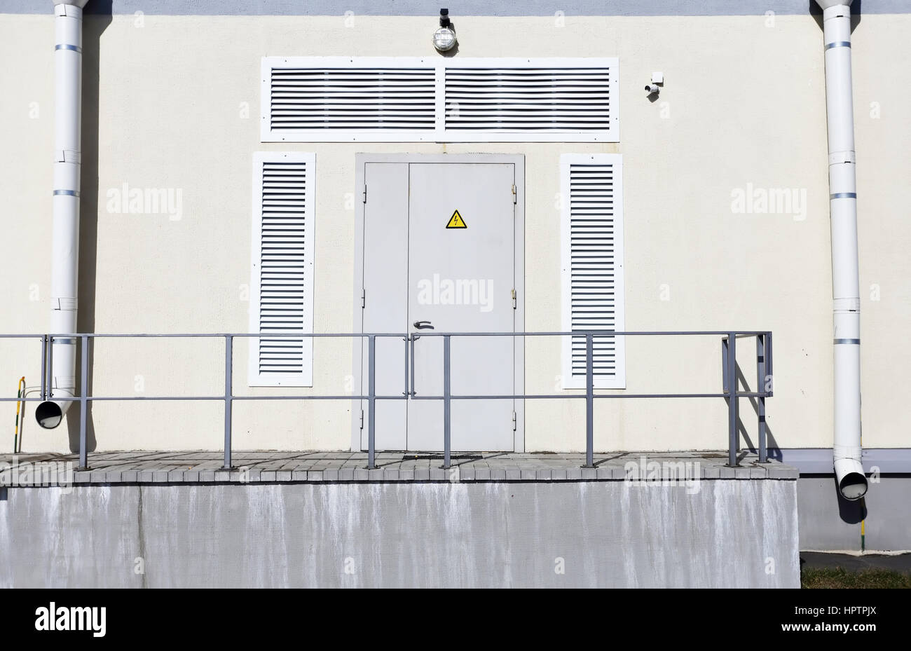 Entrance door with sign to power plant front view Stock Photo - Alamy