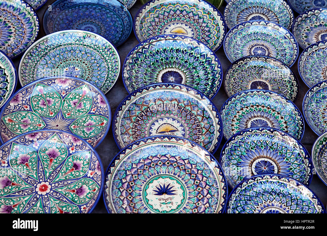 Traditional ceramic dishware in a street market, Uzbekistan Stock Photo ...