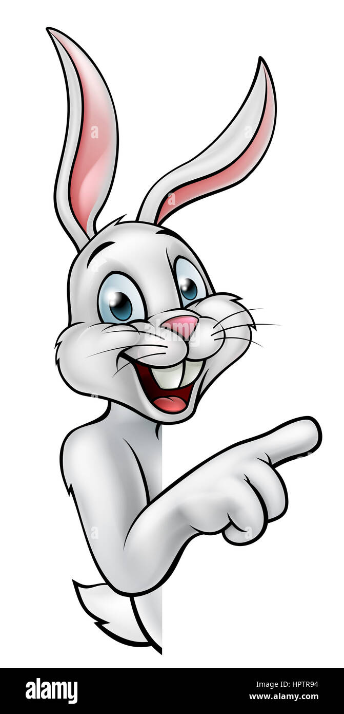 A cartoon Easter bunny or rabbit pointing around a sign Stock Photo - Alamy