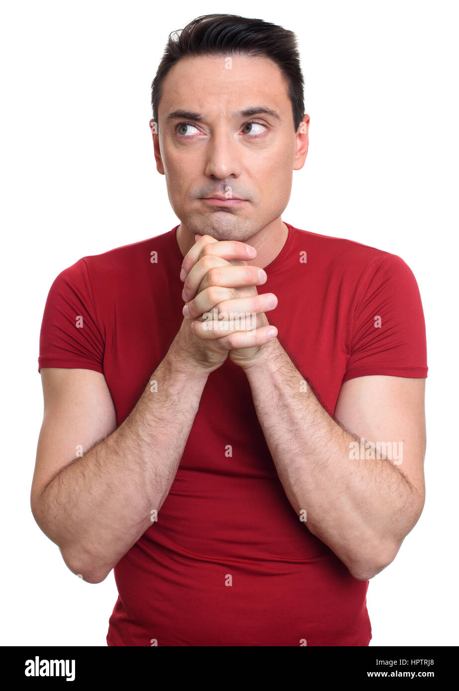 thoughtful young athletic man looking side isolated on white background ...