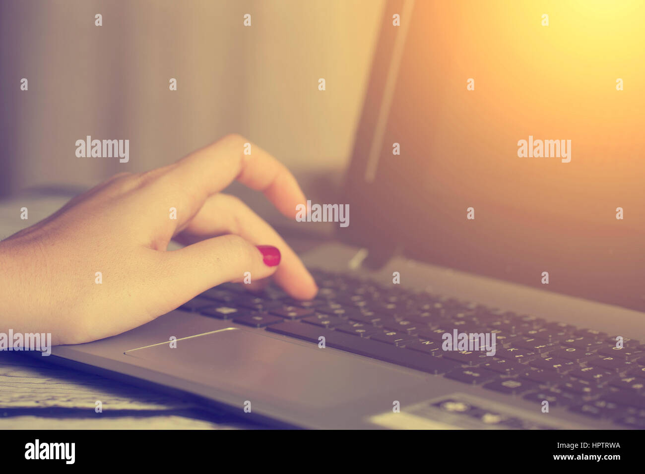 Woman hand and laptop Stock Photo - Alamy