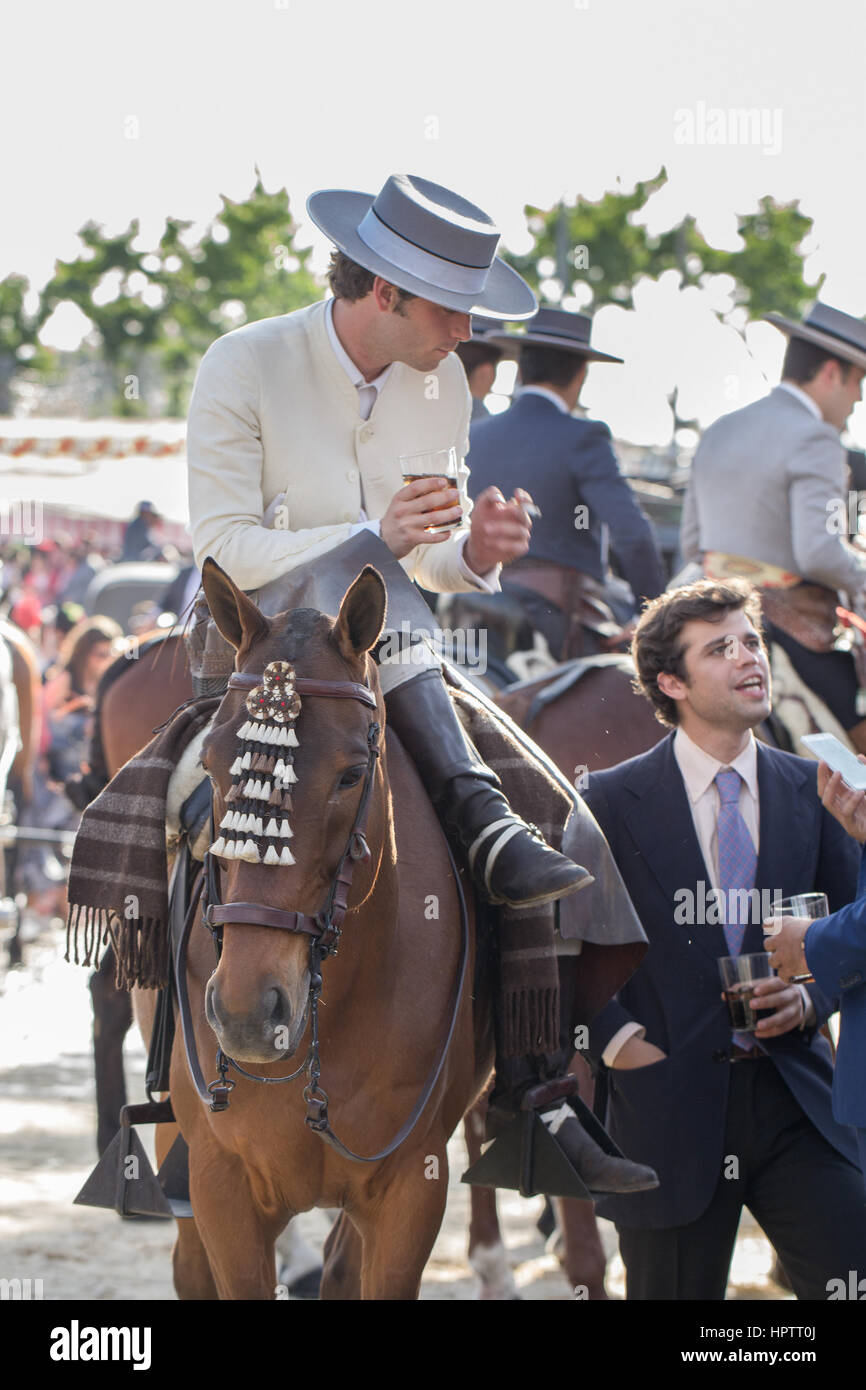 SEVILLE, SPAIN - APR, 25: man dressed in traditional costume riding ...