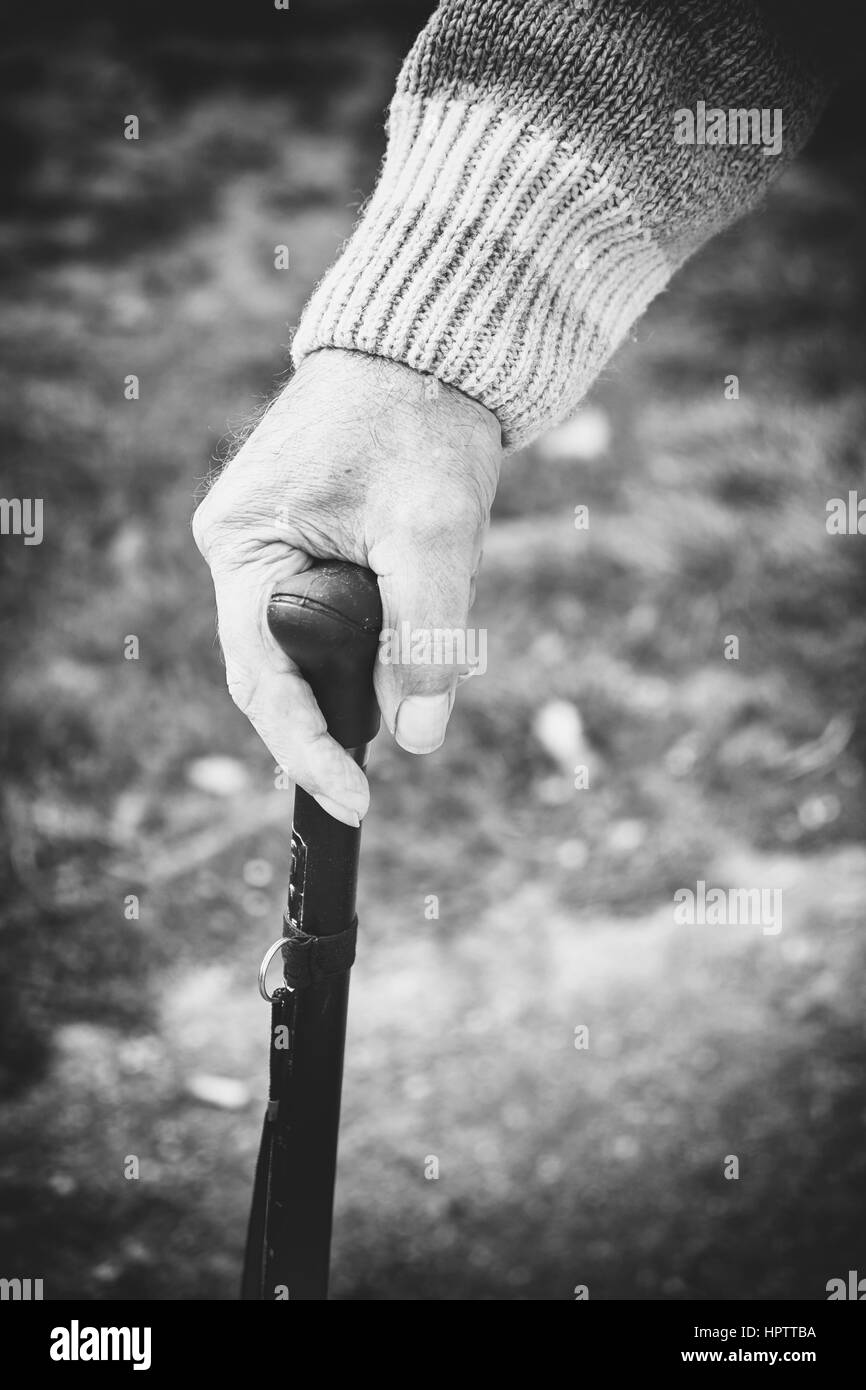 Senior man with walking stick Stock Photo - Alamy