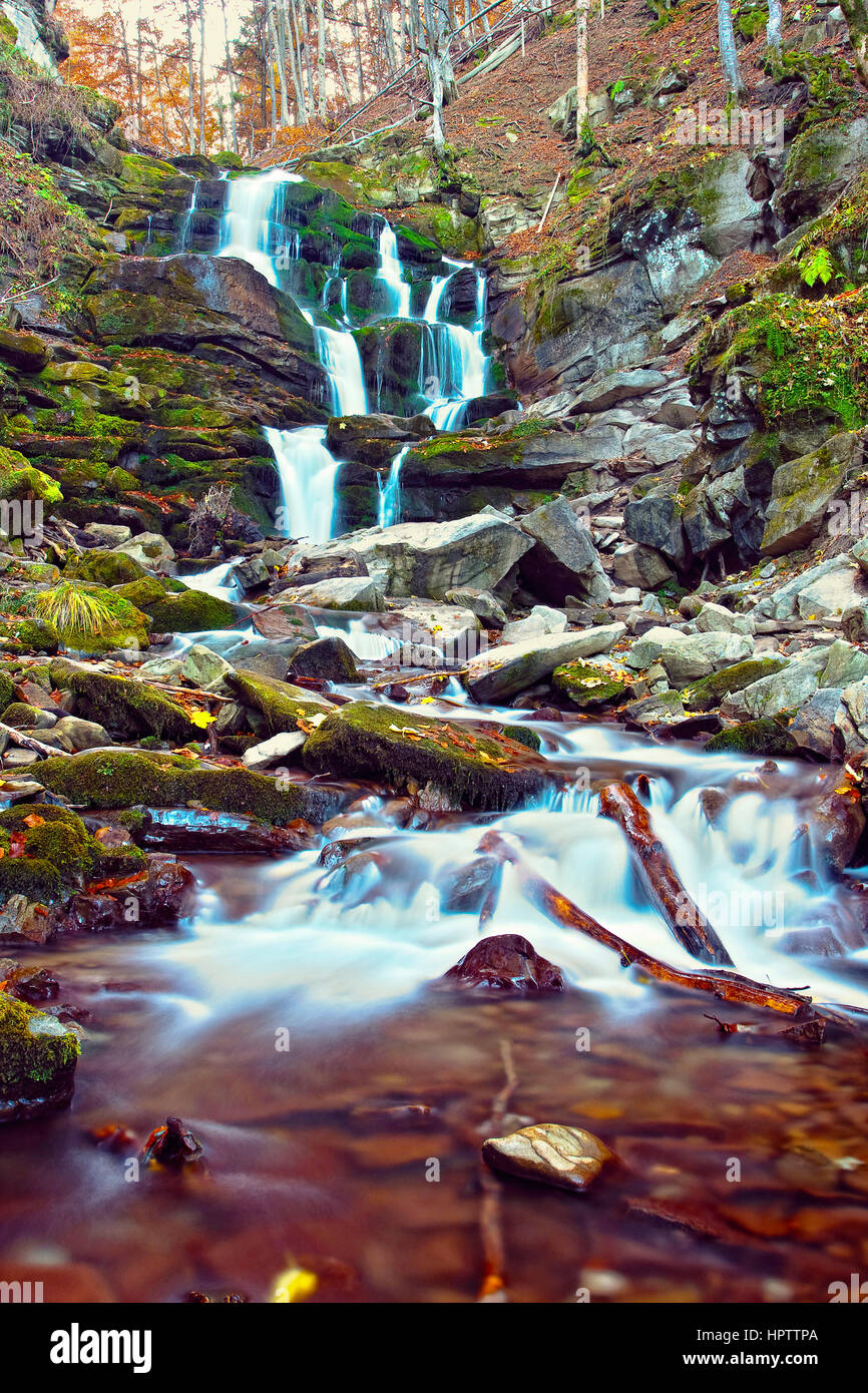 big waterfall cascade in the middle of mountains Stock Photo - Alamy