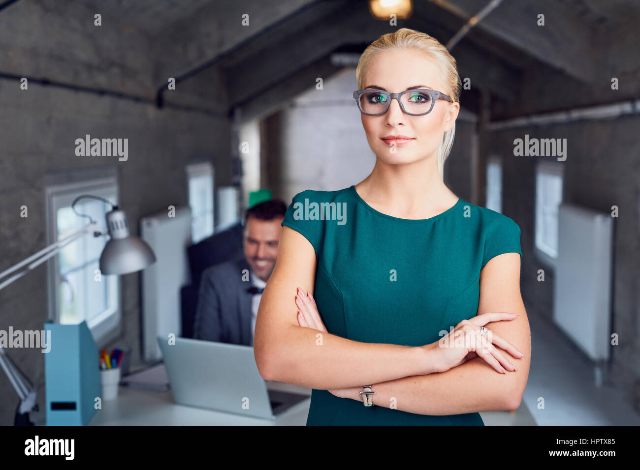 Confident female manager standing in modern office Stock Photo - Alamy
