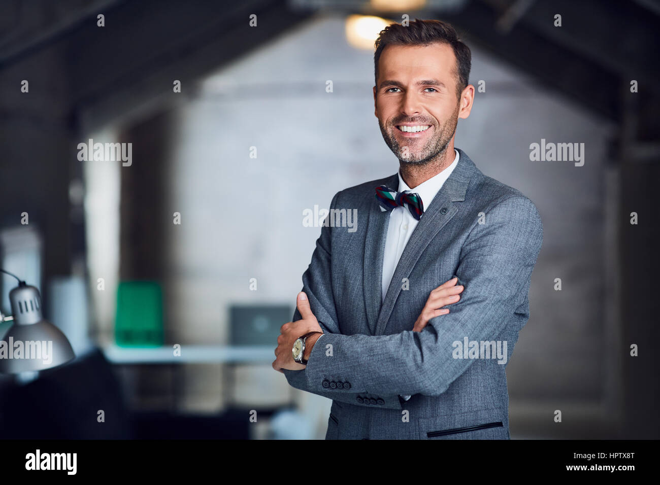 Successful manager, businessman standing in office Stock Photo - Alamy
