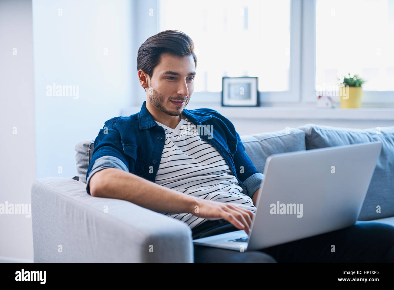 Relaxed guy sitting on comfortable hi-res stock photography and images ...