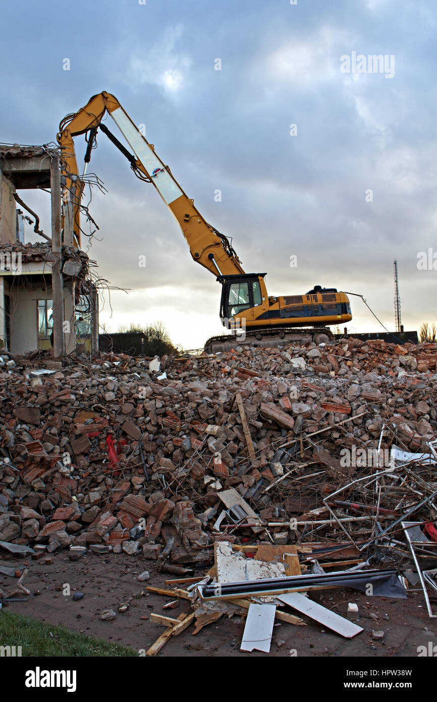 Construction Site Excavator Dismantling a Building Stock Photo - Alamy