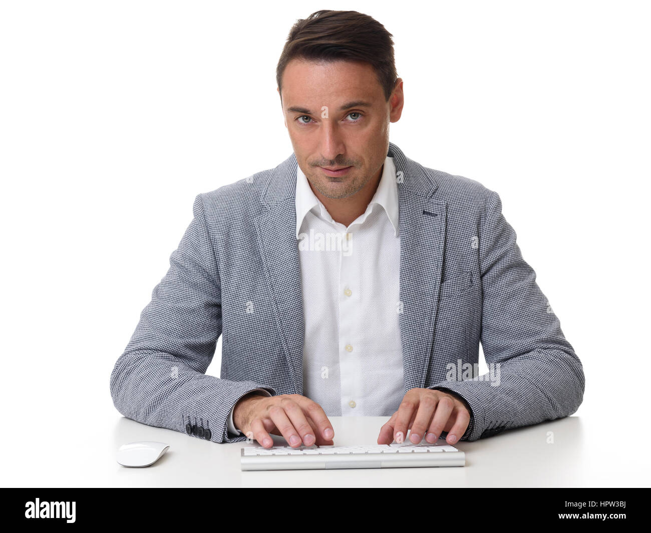 handsome businessman typing on keyboard. Isolated on white background ...