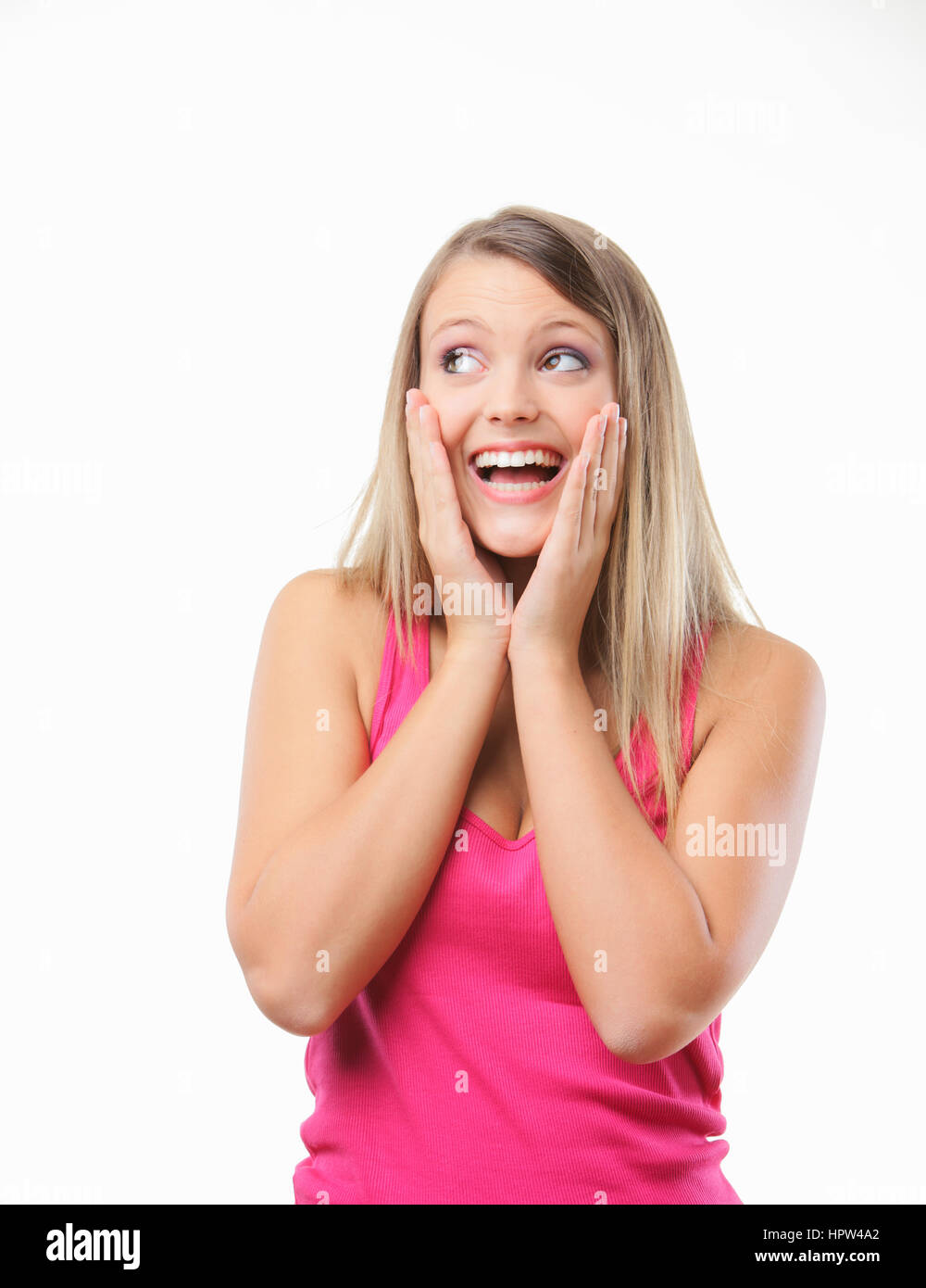 Portrait of attractive young female looking excited on white background ...