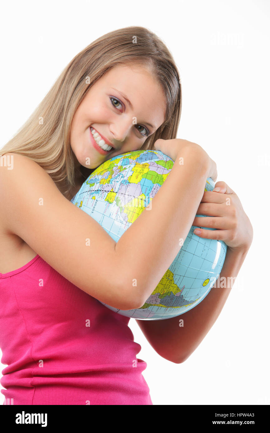 Portrait Of A Happy Blonde Girl Embracing A Globe Against White