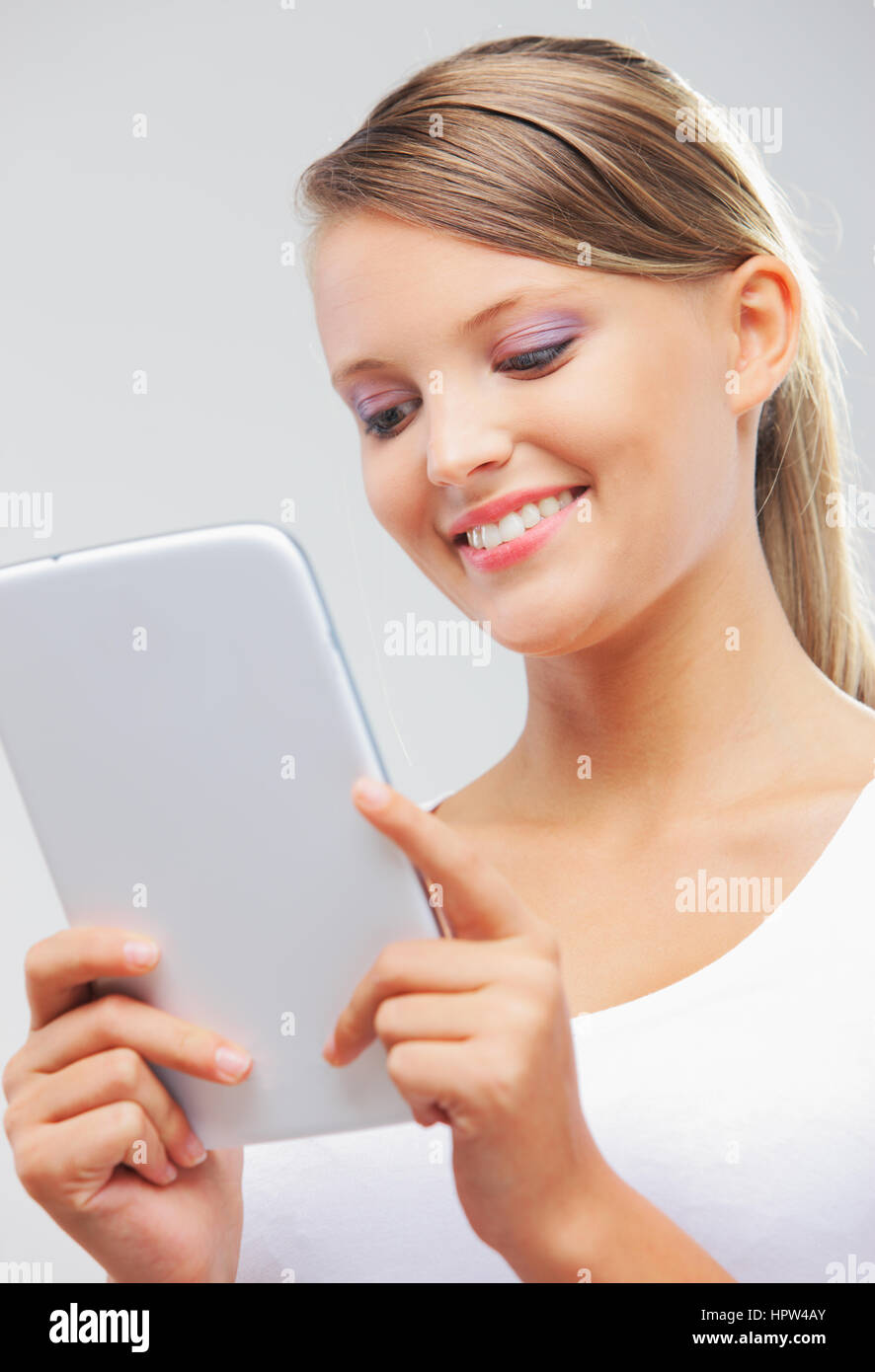 Portrait of beautiful girl with her digital tablet Stock Photo - Alamy
