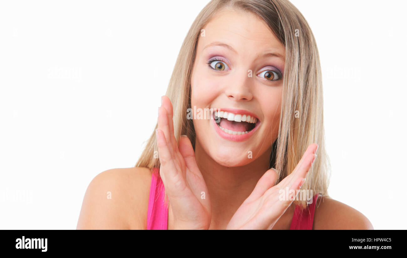 Portrait of attractive young female looking excited on white background ...