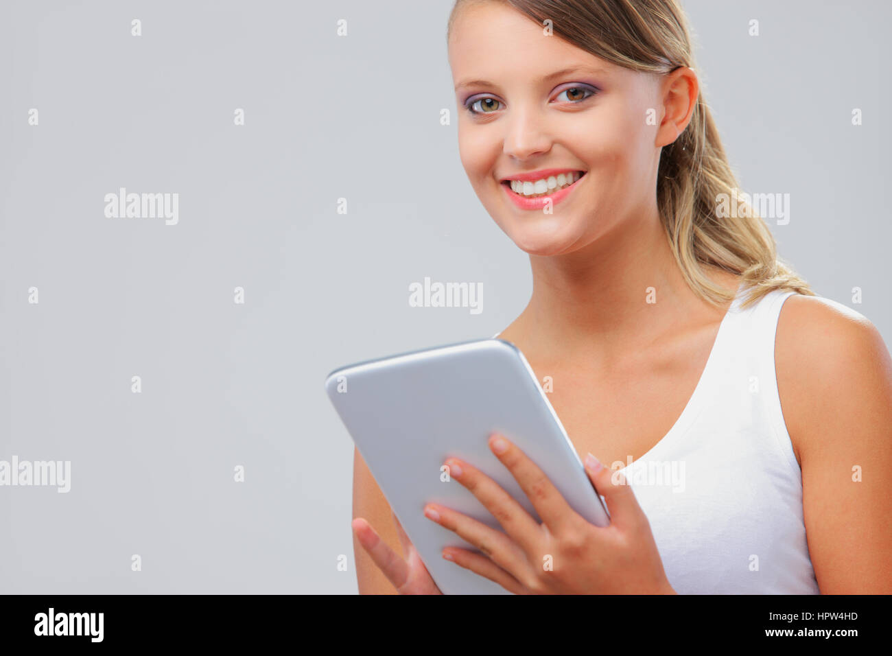 Portrait of beautiful girl with her digital tablet Stock Photo - Alamy