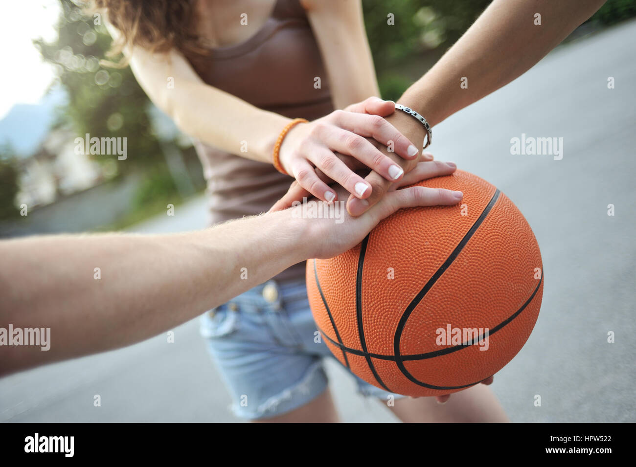 Everybody put his hand on the other, friendship concept Stock Photo - Alamy