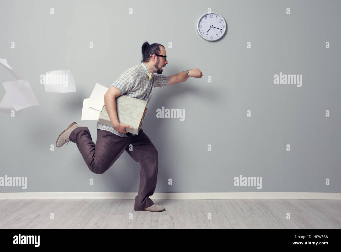 Stressed business man rushing in the office Stock Photo - Alamy