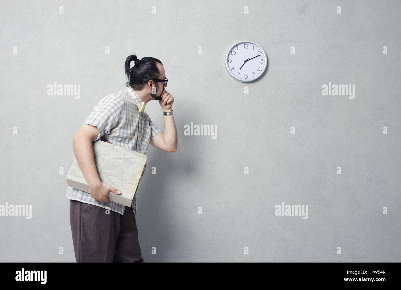 Man checking time in a waiting room Stock Photo - Alamy